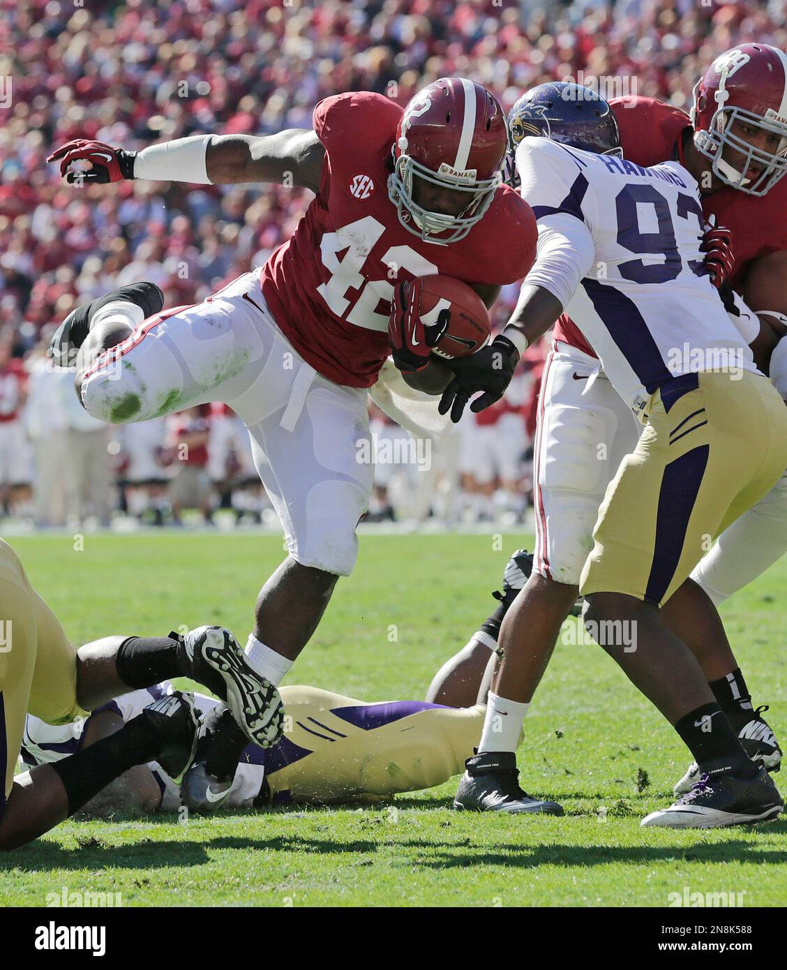 Alabama running back Eddie Lacy (42) scores on a 7 yard touchdown run ...