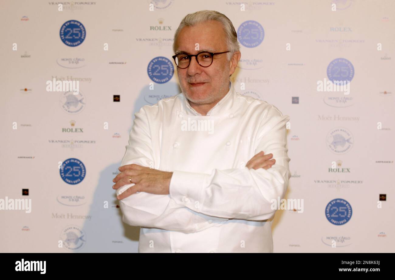French chef Alain Ducasse poses for phtographers as he celebrates the ...