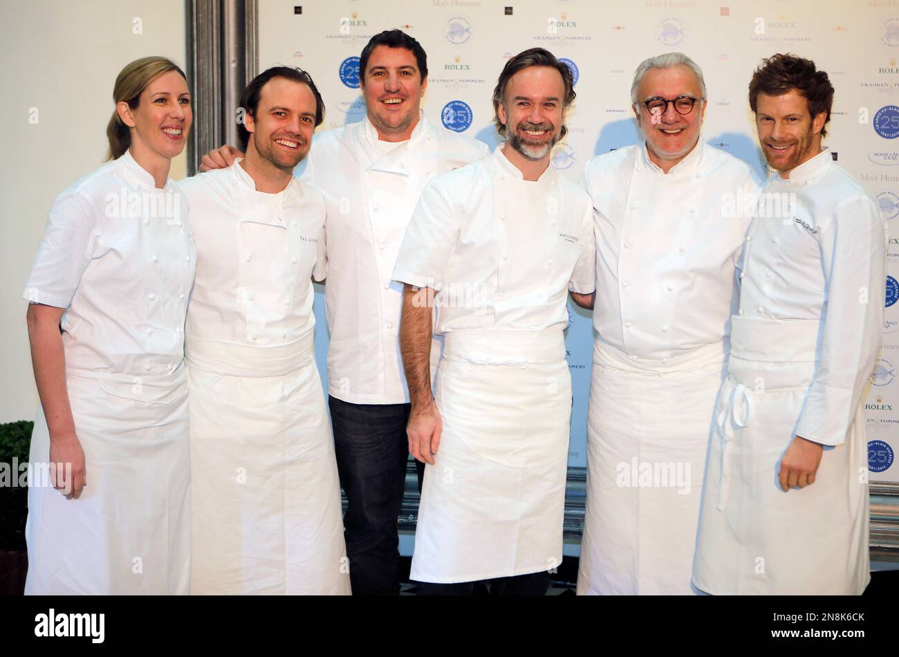 French chef Alain Ducasse meets second from right, poses with left to ...