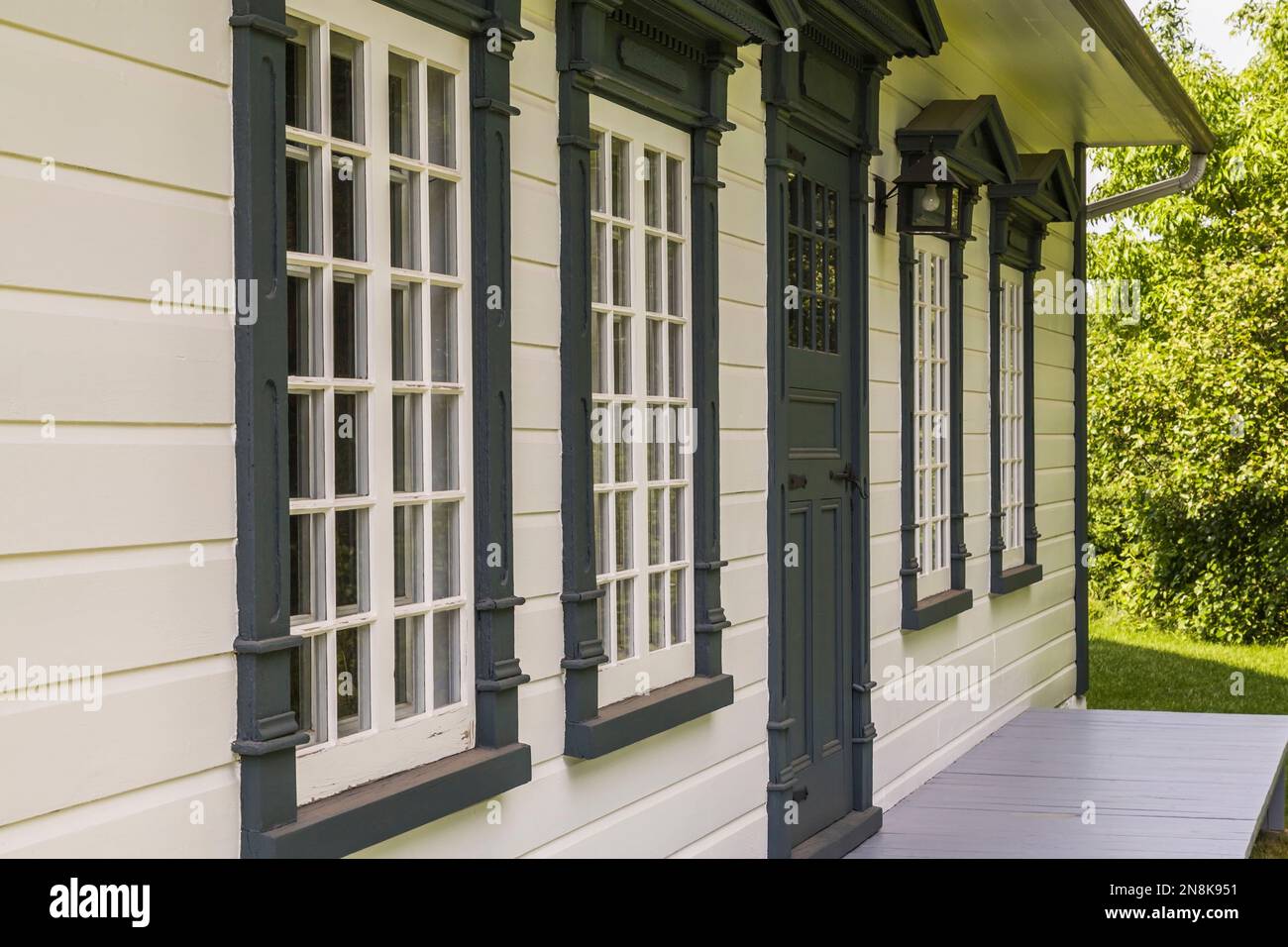 Old 1809 French regime cottage style home facade and veranda with white ...