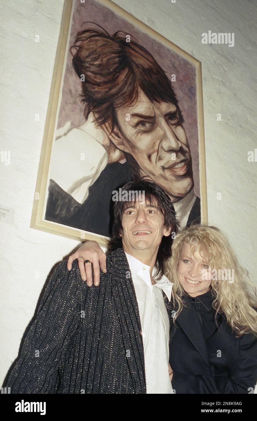 Ronnie Wood, guitarist with the Rolling Stones, left, and his wife, Jo ...