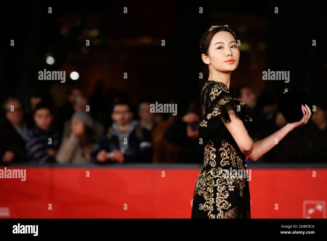 Actress Li Chengyuan poses for photographers as she arrives for the ...