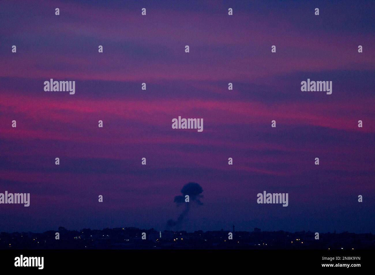 Smoke rises following an Israeli strike in the Gaza Strip, seen from ...
