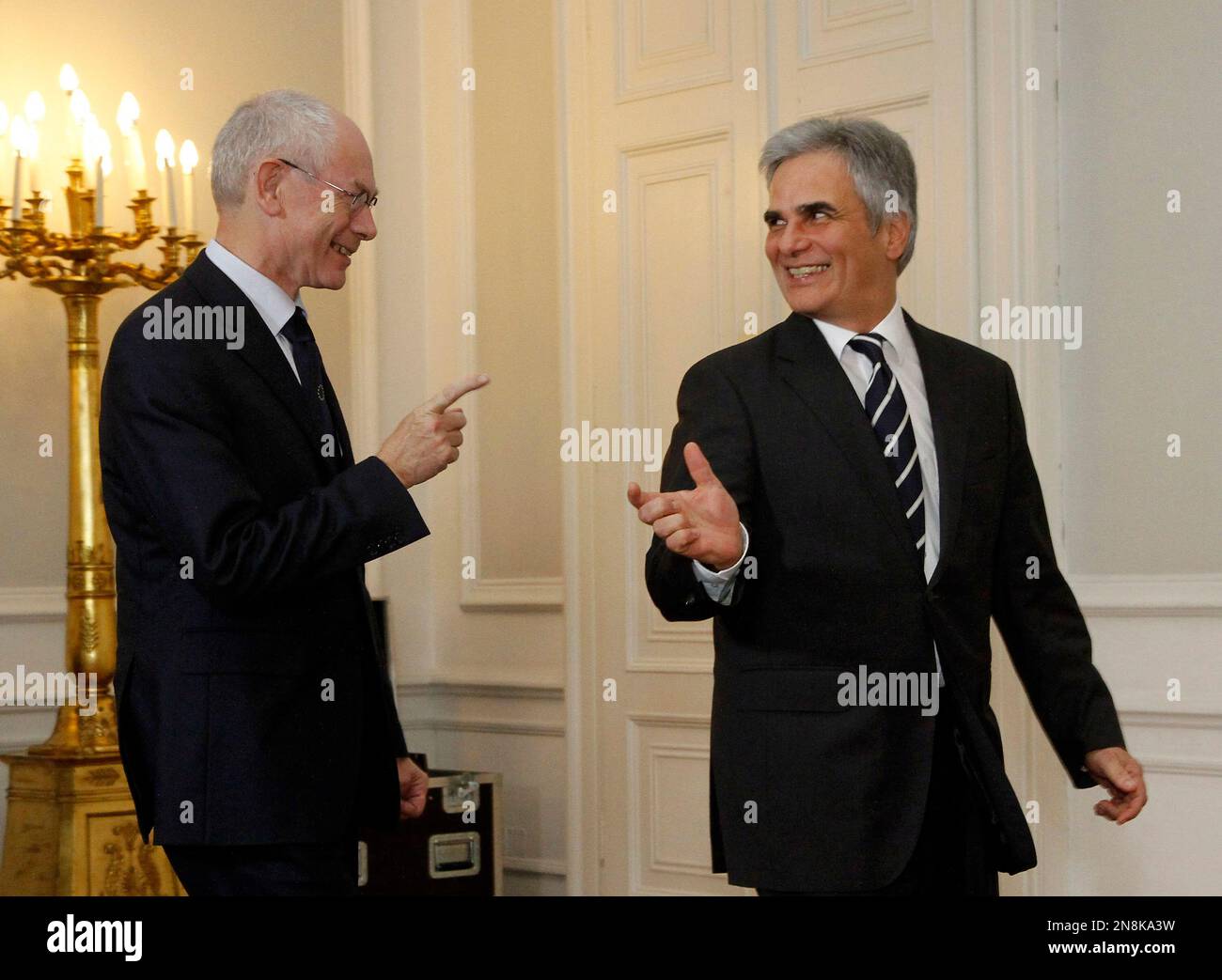 Austrian Chancellor Werner Faymann, right, shares a word with Herman ...