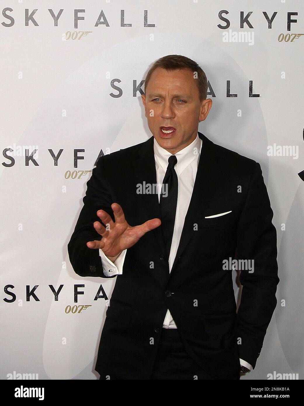 Actor Daniel Craig gestures as he arrives for the premier of the latest ...