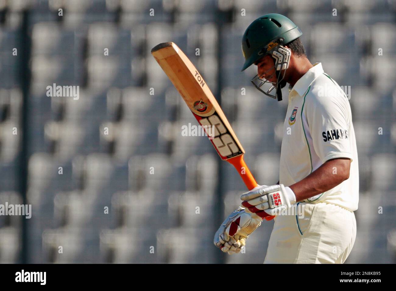 Bangladesh's Mohammad Mahmudullah acknowledges the crowd after scoring ...