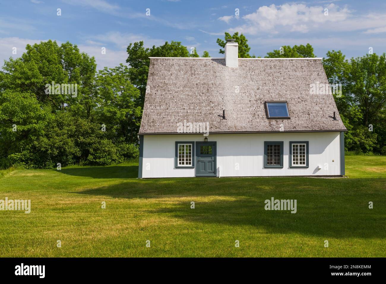 Rear view of old 1809 French regime cottage style home with white ...