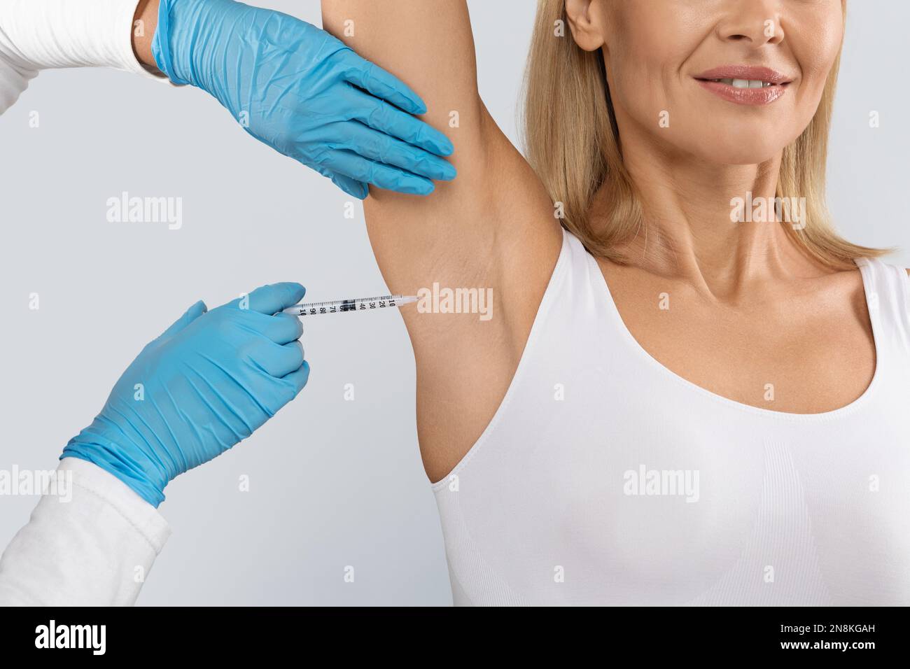 The doctor makes intramuscular injections in the underarm area Stock ...