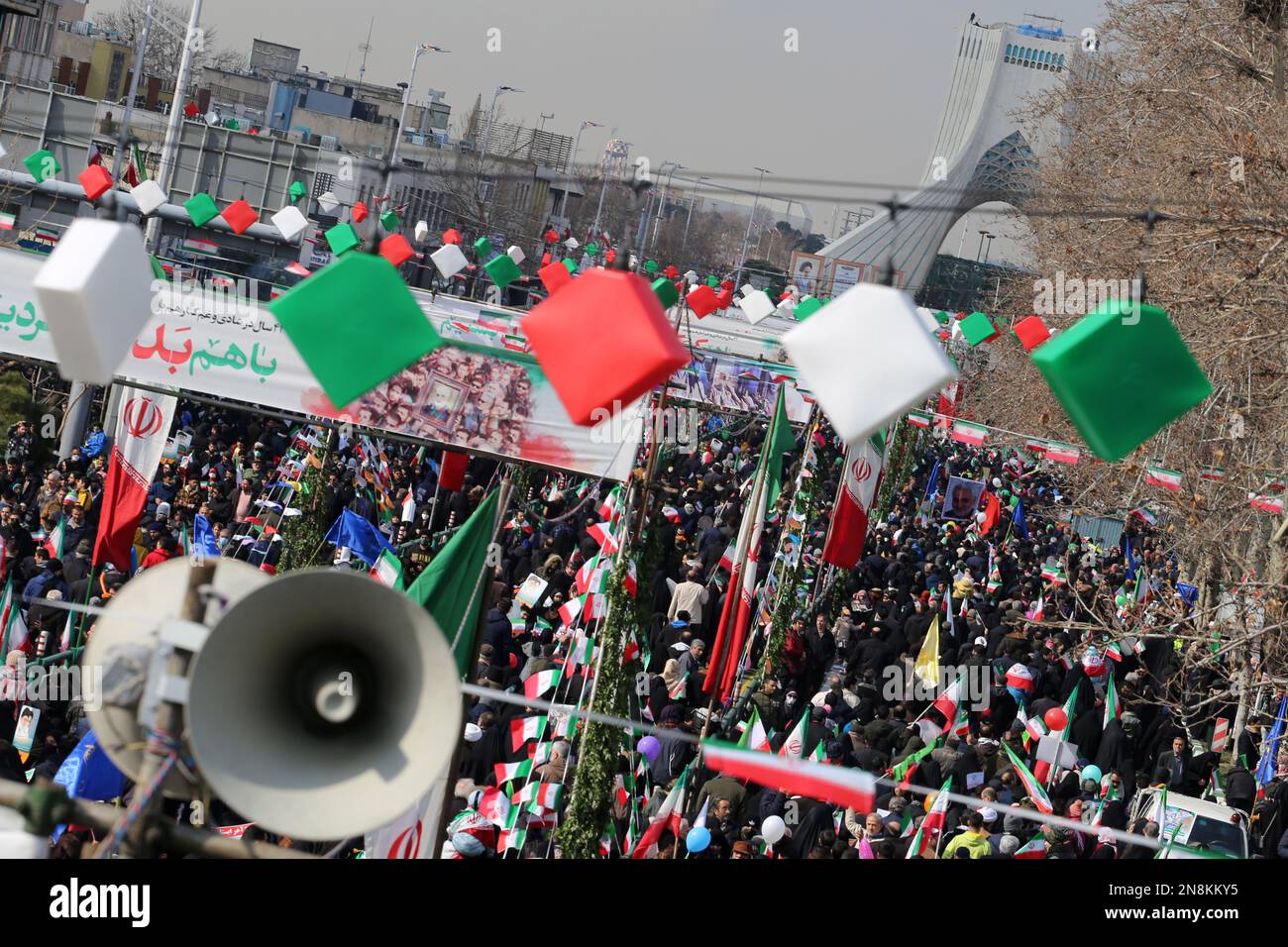 Tehran, Tehran, Iran. 11th Feb, 2023. Demonstrators take part next to ...