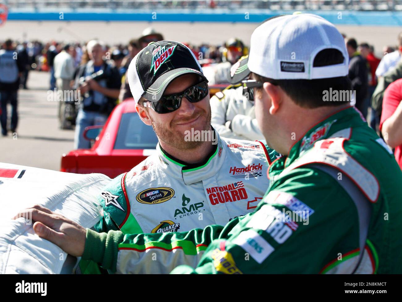 Dale Earnhardt Jr., left, talks with car chief Jason Burdett prior to a ...