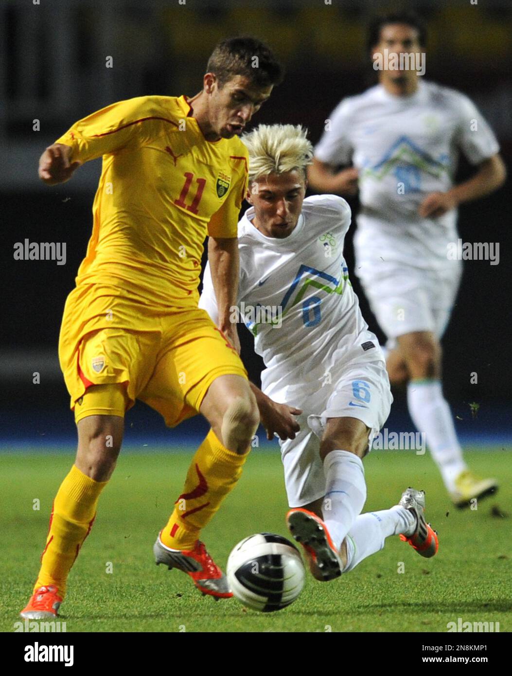 Slovenia's Kevin Kampl, right, challenges with Macedonia's Ferhan ...