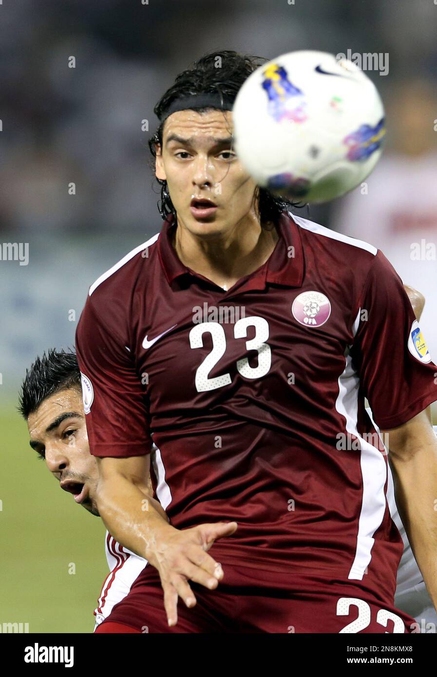 Qatar's national team player Sebastian Suria, front, vies for the ball ...