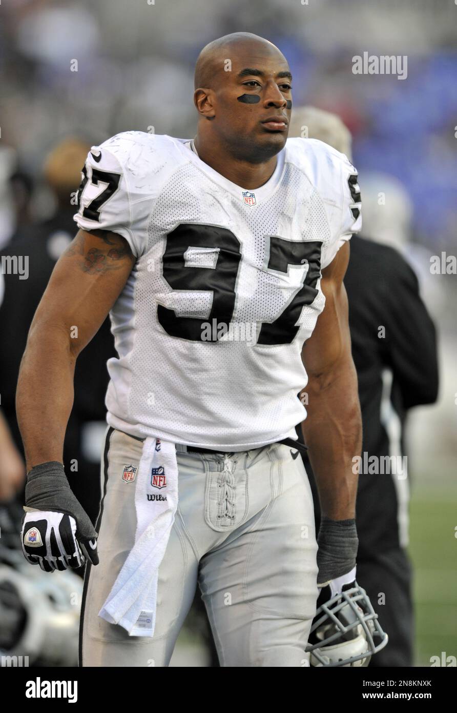 Oakland Raiders defensive end Andre Carter walks on the sideline during ...