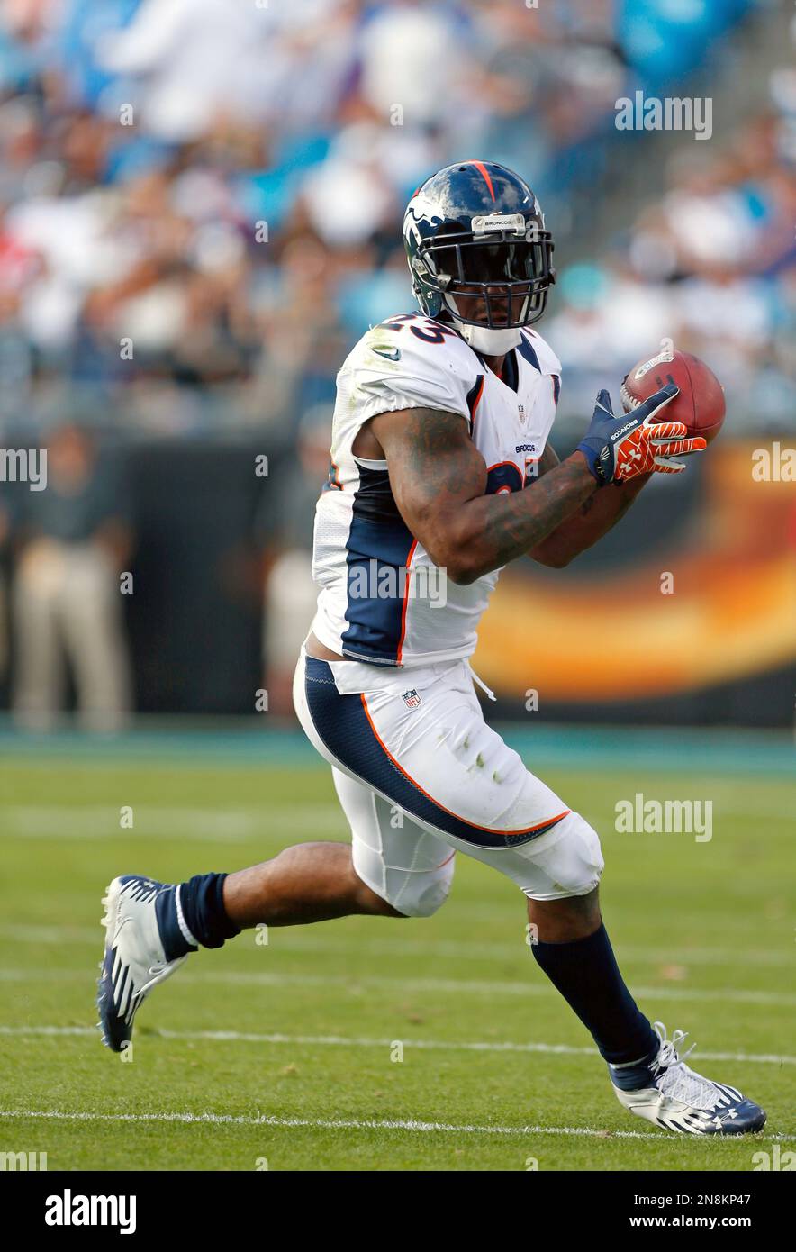 Denver Broncos' Willis McGahee (23) looks upfield as he hauls in a pass ...