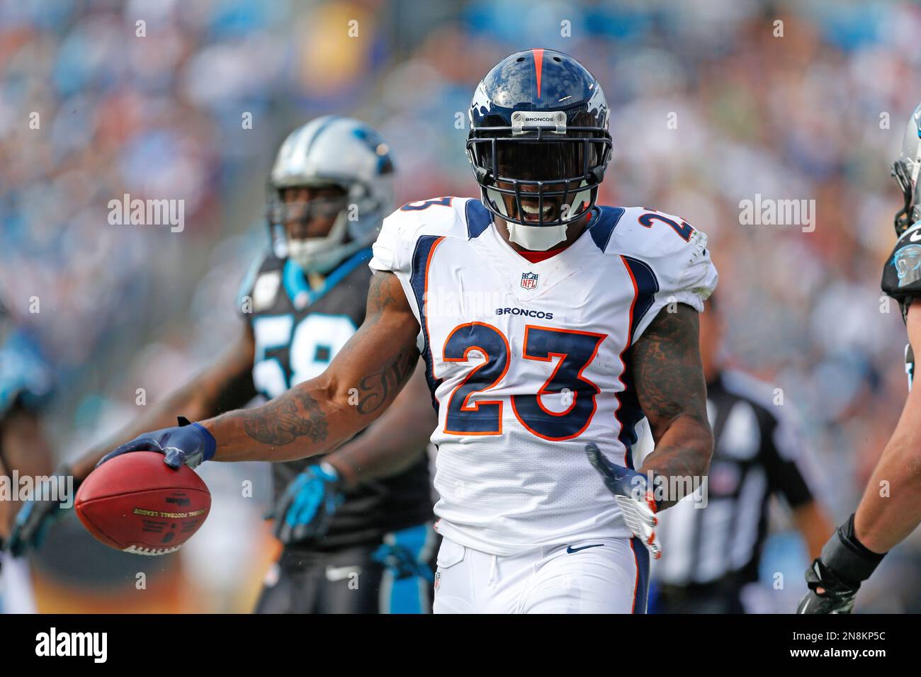 Denver Broncos' Willis McGahee (23) celebrates his positive yardage ...
