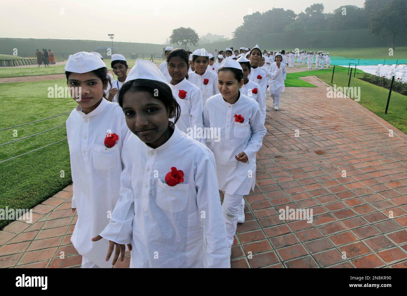 School children, wearing caps popularly known as Nehru caps, return ...