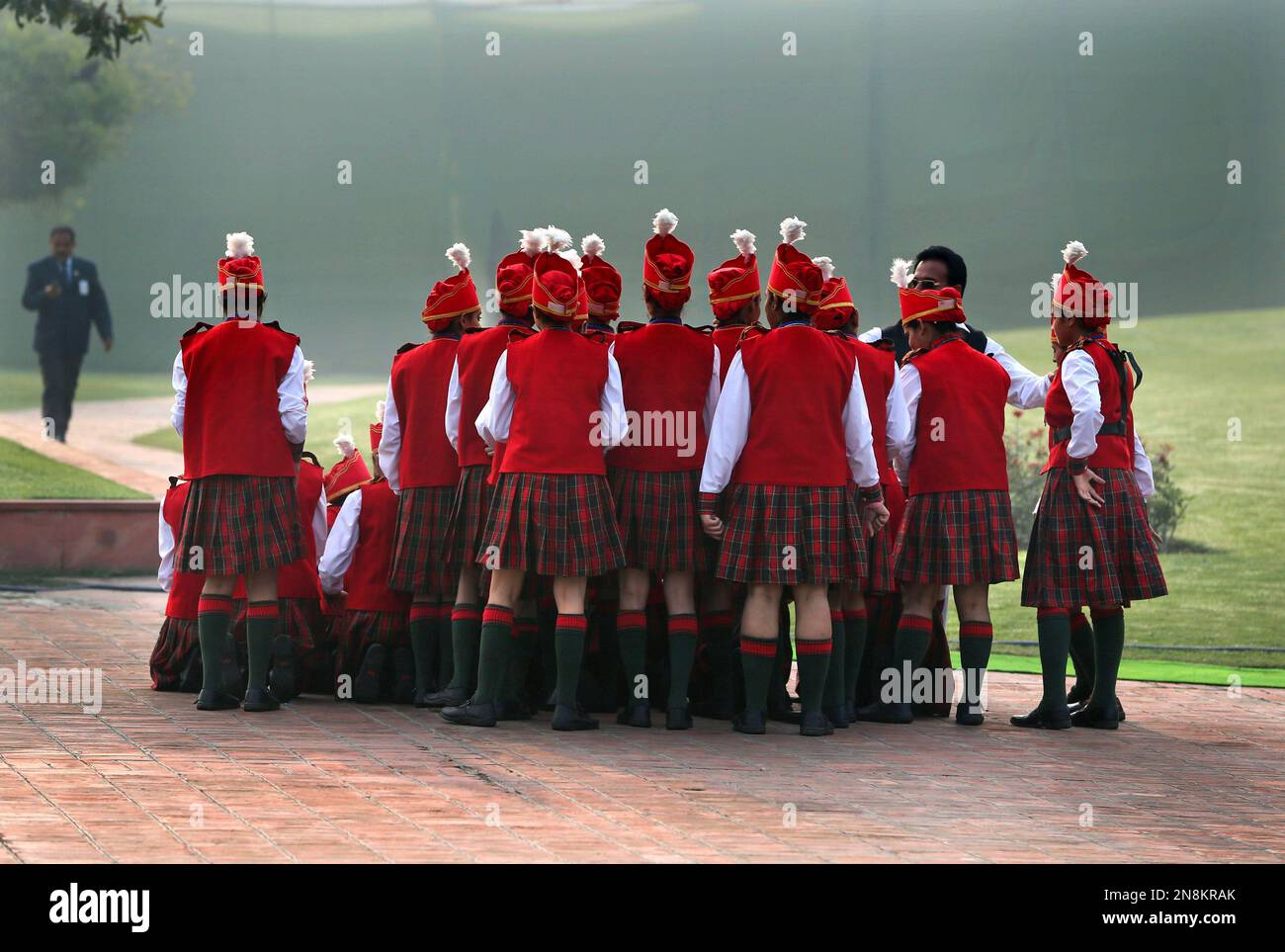 School children huddle together for a group photograph after a function ...