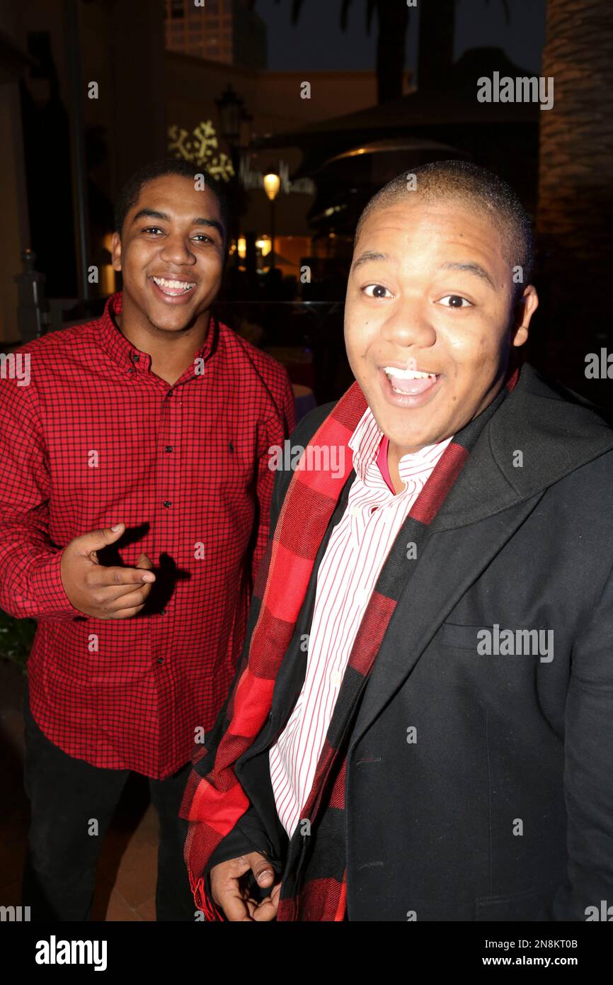 From Left Disney Stars Brothers Christopher Massey And Kyle Massey Pose During The Christmas