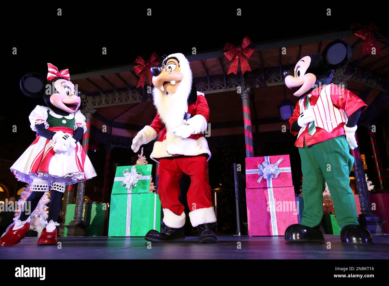From left, Minnie Mouse, Goofy and Mickey Mouse perform during the ...