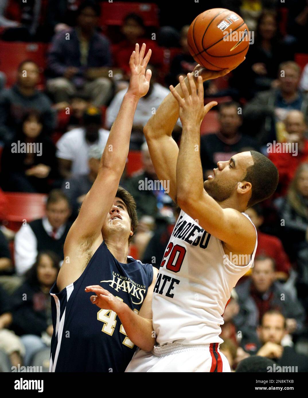 San Diego State forward JJ O'Brien goes over San Diego Christian's ...