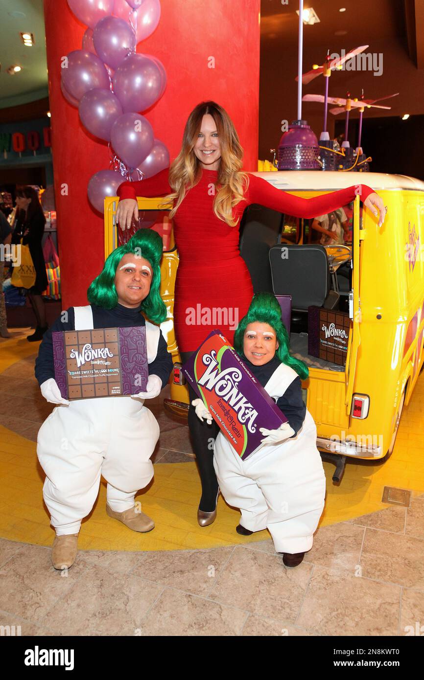 Natasha Alam, left, is seen with Oompa Loompas at the new Wonka store ...