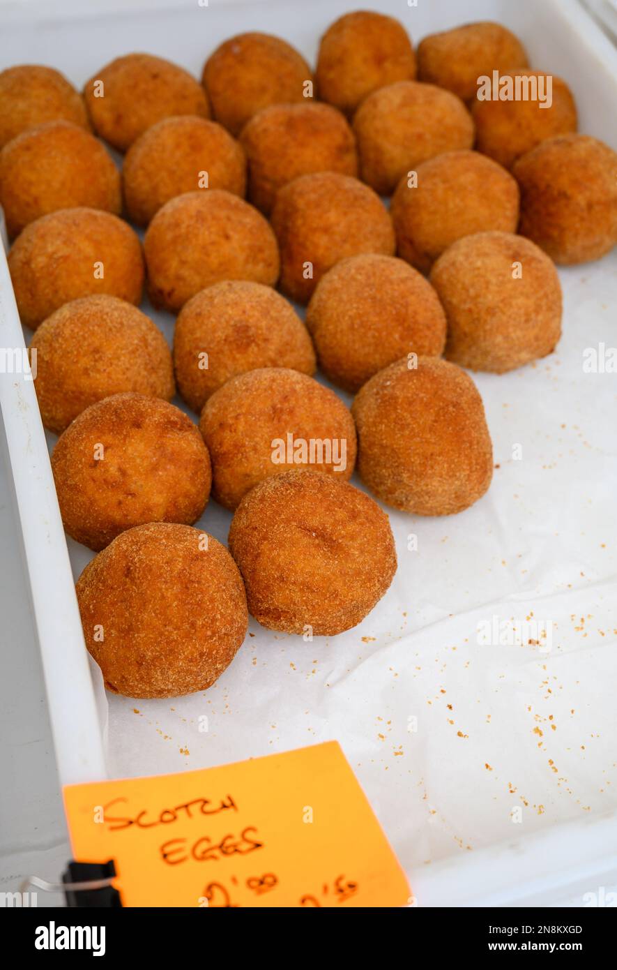 Traditional street food in UK, stuffed fried Scotch eggs with ...