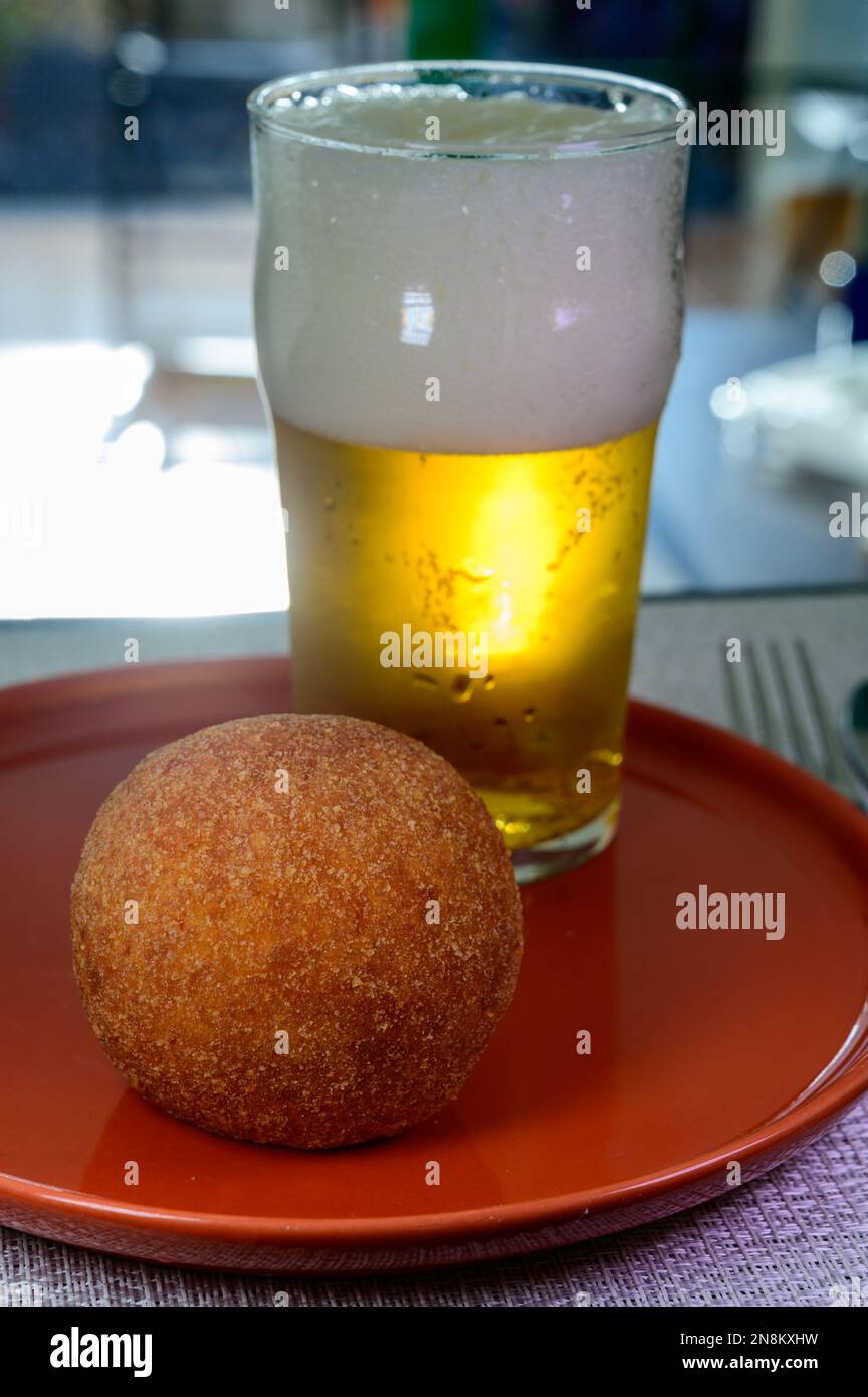 Traditional street food in Scotland, glass of fresh lager beer and ...