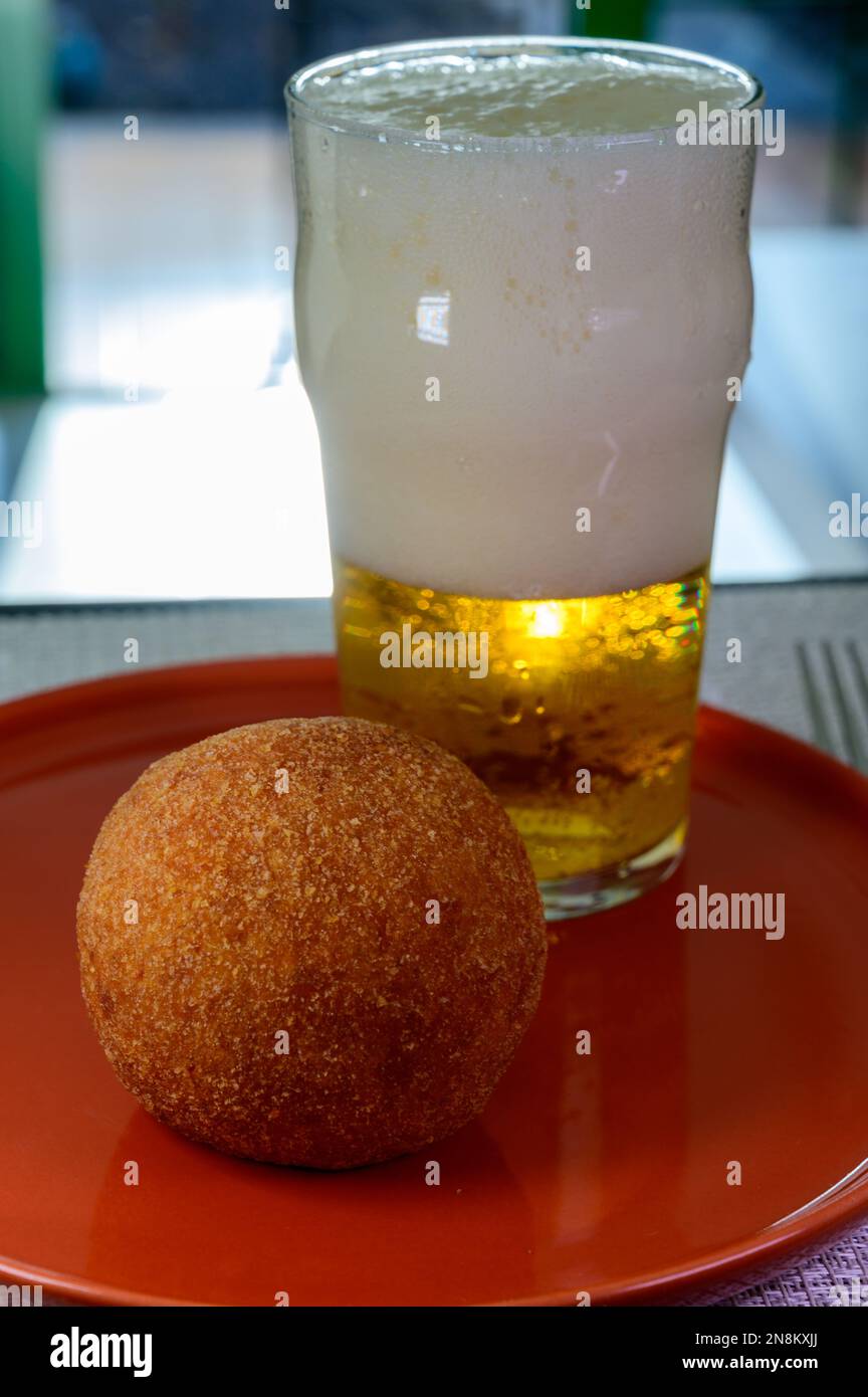 Traditional street food in Scotland, glass of fresh lager beer and ...