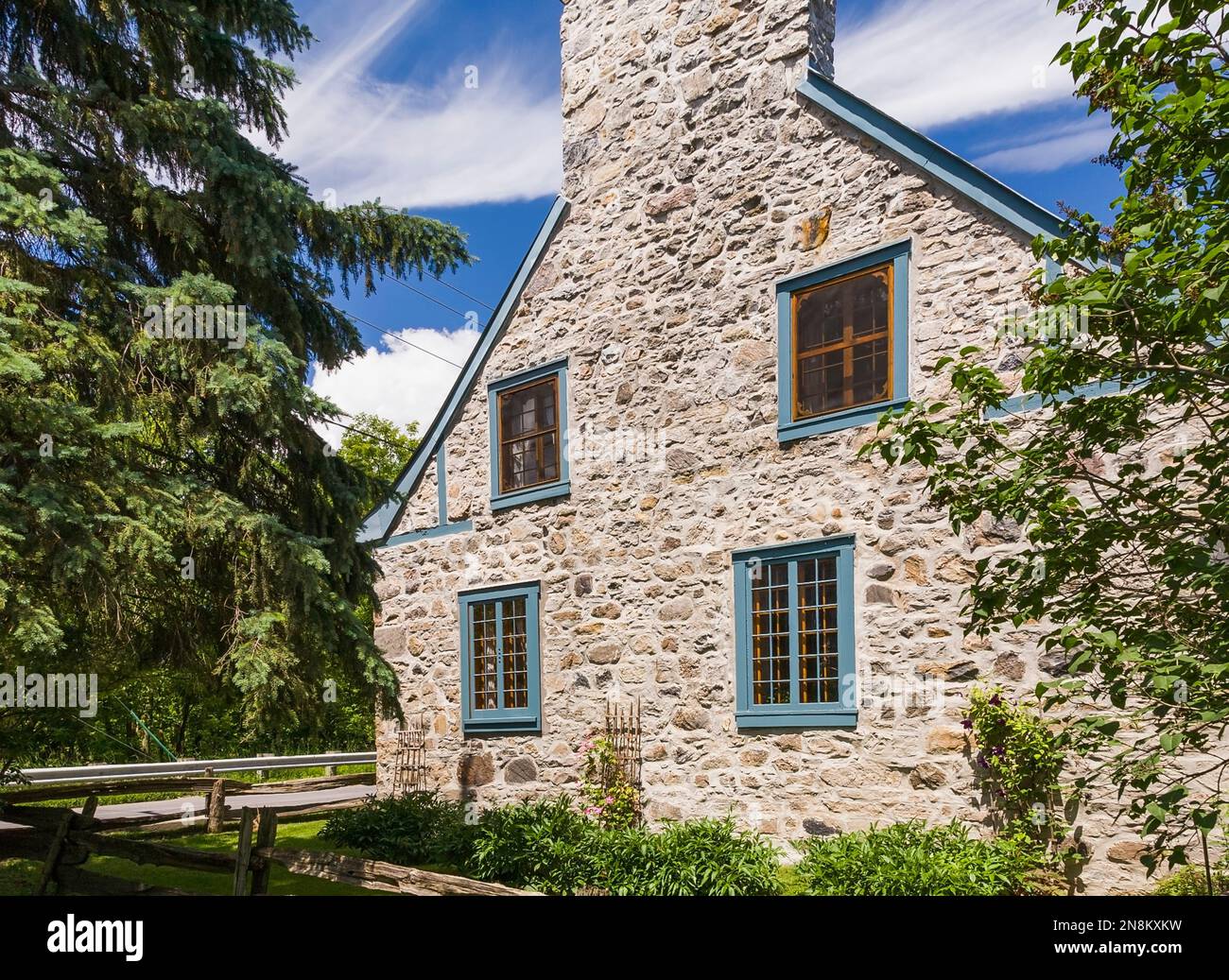 Side view of old circa 1760 Canadiana fieldstone cottage style house in ...