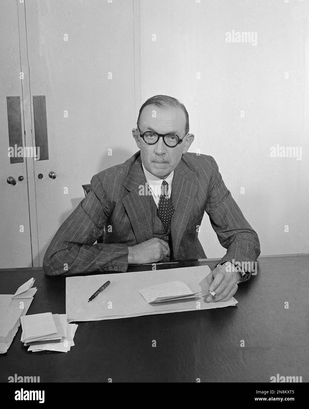 Sir Henry Lovell Goldsworthy Gurney is shown at his desk in London ...