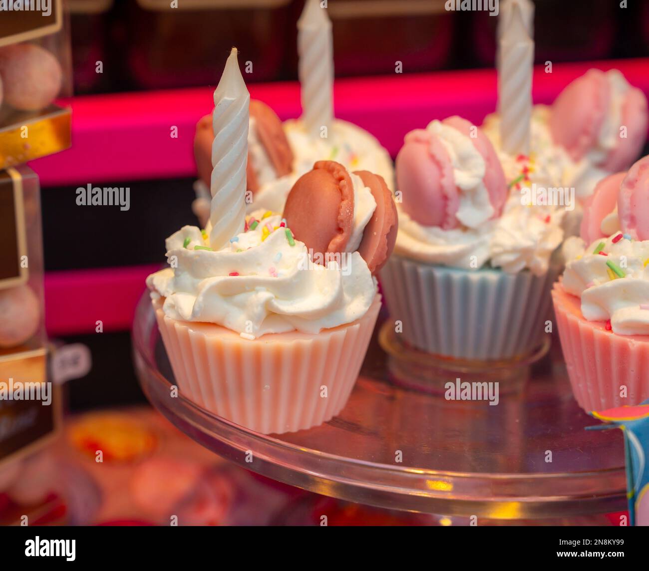 Assortment of french fresh baked sweet pastry, rose cupcakes with ...