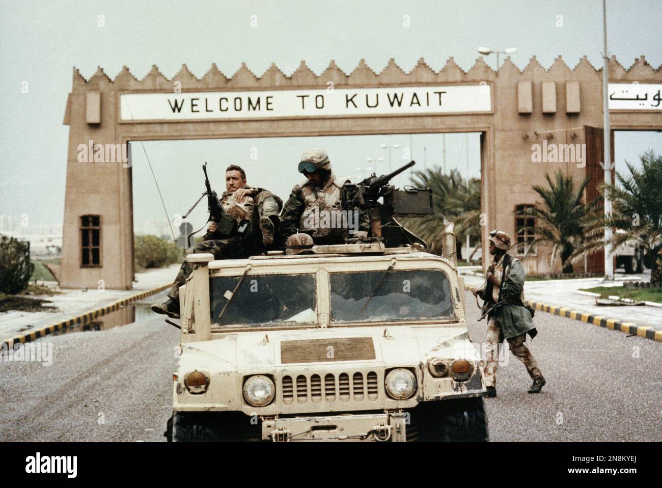 Members of Task Force Ripper of the First Marine Division ride a Humvee ...