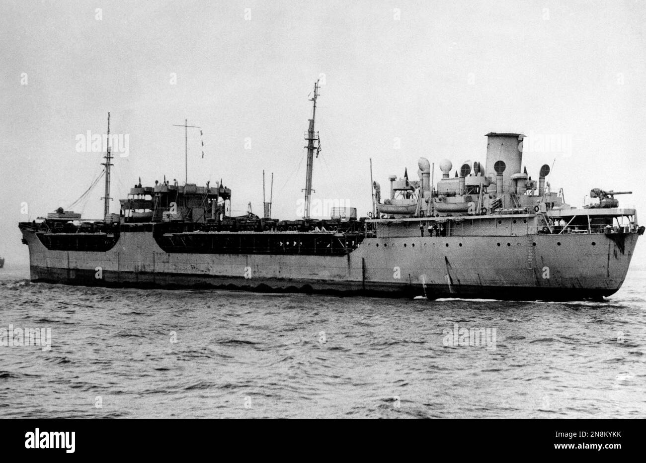 A Liberty ship loaded with trucks leaves a U.S. east coast port on ...