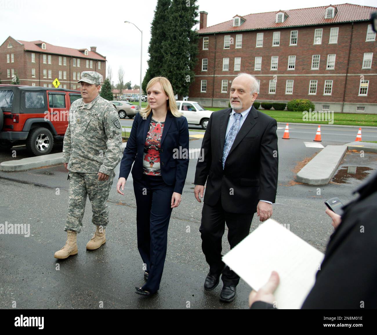 Emma Scanlan, center, the civilian defense attorney for U.S. Army Staff ...