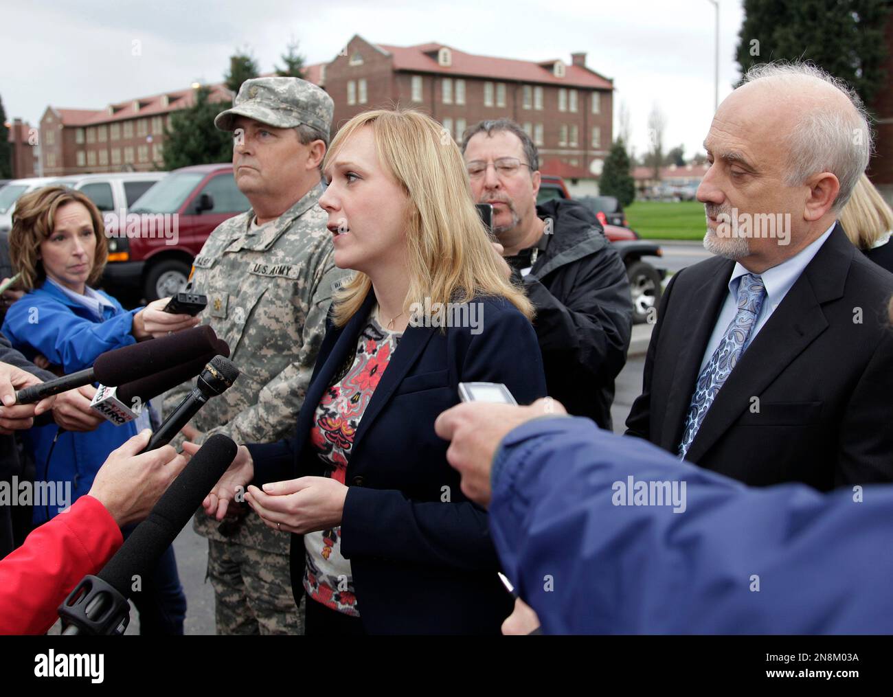 Emma Scanlan, center, the civilian defense attorney for U.S. Army Staff ...