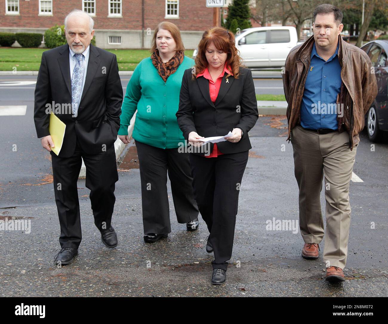 Kari Bales, second from left, walks with attorney Lance Rosen, left ...