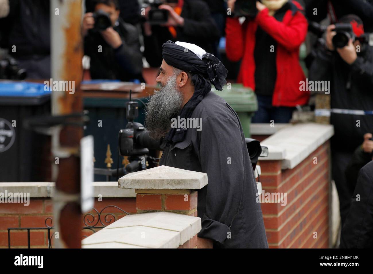 Abu Qatada returns to his residence in London, Tuesday, Nov. 13, 2012 ...