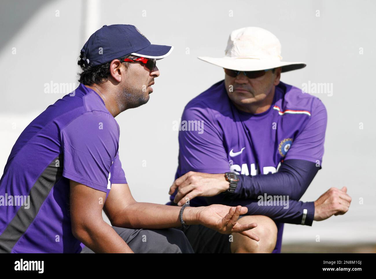 India's Yuvraj Singh, left, talks with bowling coach Joe Dawes during a ...