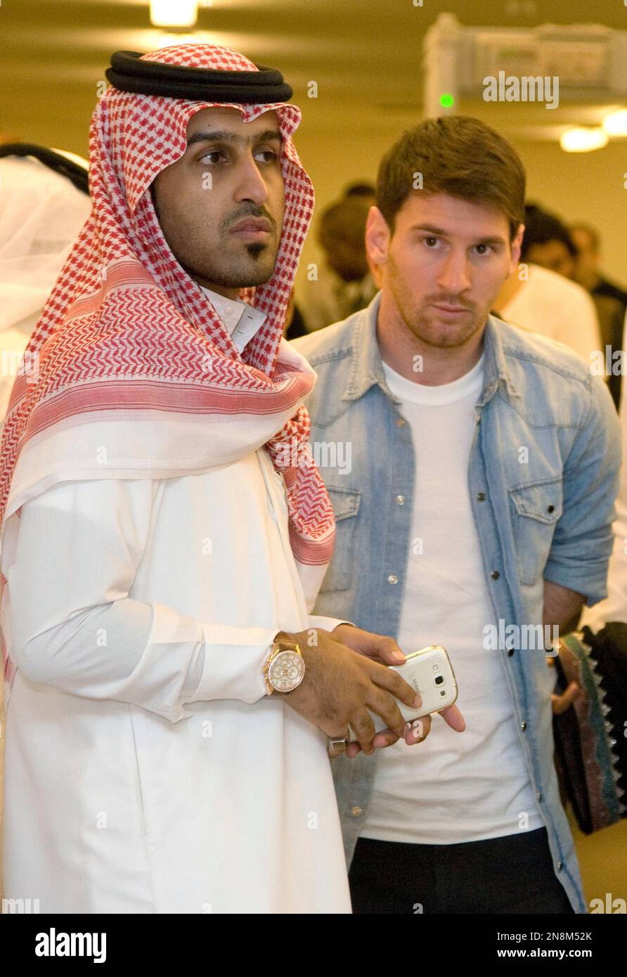Argentina's Lionel Messi, right, arrives with his team to the Saudi ...