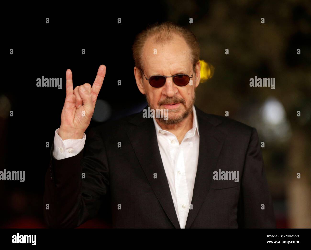 Director Larry Clark gestures for photographers as he arrives for the ...