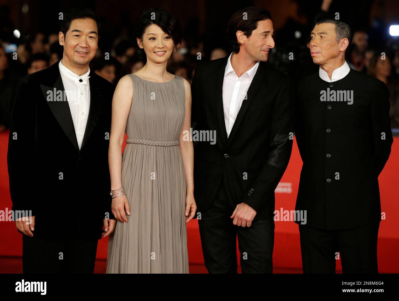 From left, actor Zhang Guoli, actress Xu Fan, actor Adrien Brody and director Feng Xiaogang pose ...