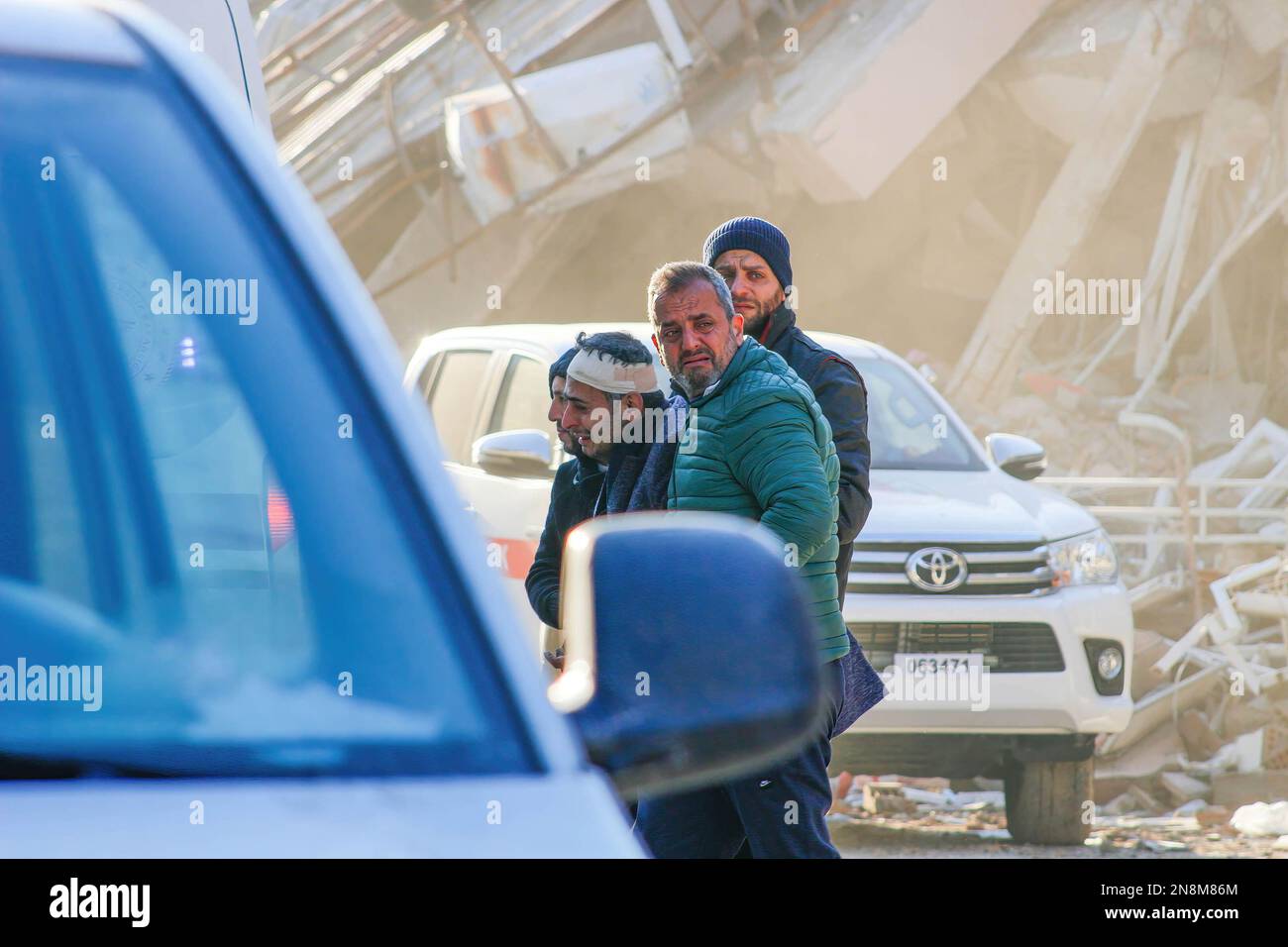 Neighbors seen crying while trying to save their relatives under the ...