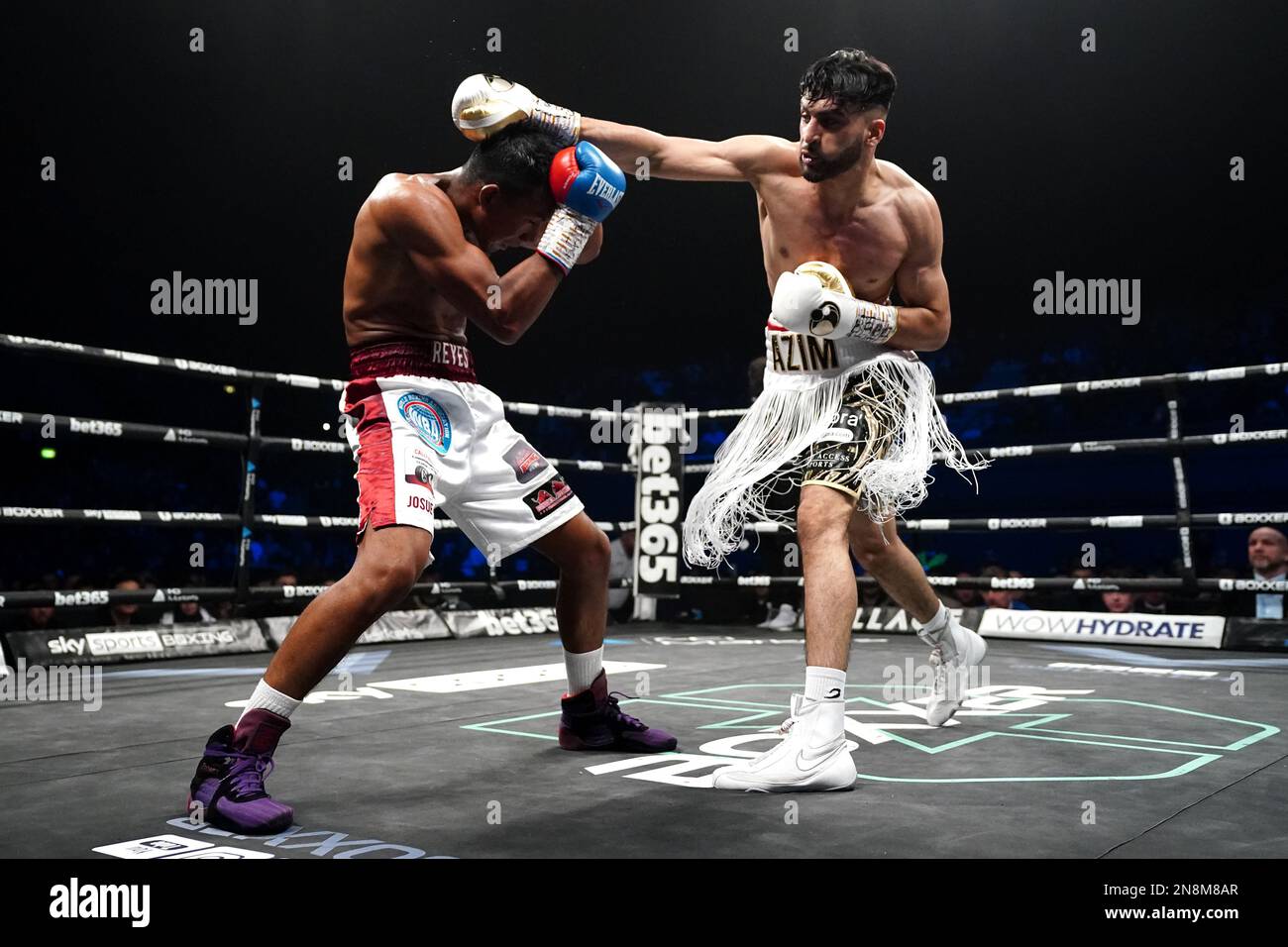 Adam Azim in action against Santos Reyes at the OVO Arena Wembley ...
