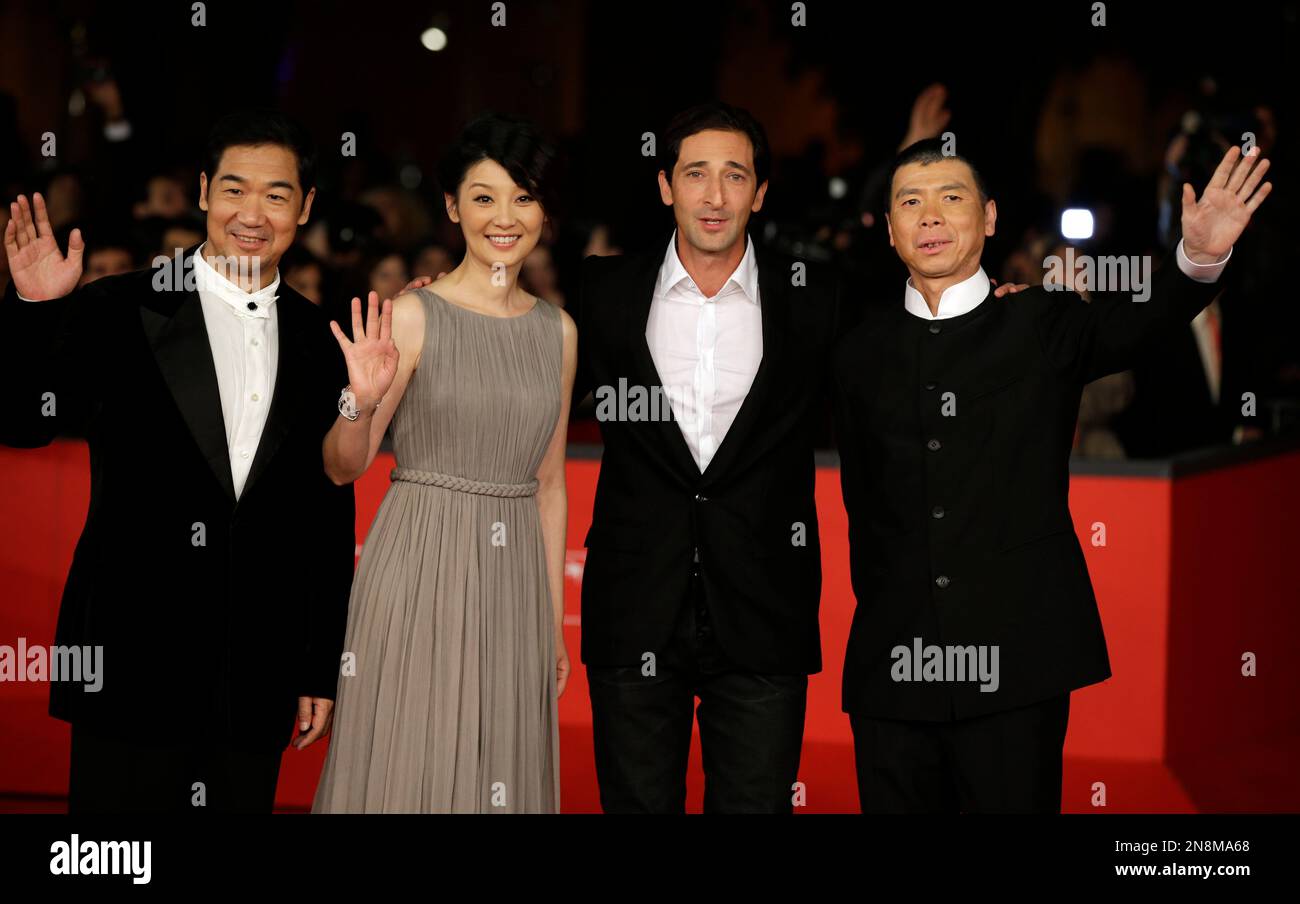 From left, actor Zhang Guoli, actress Xu Fan, actor Adrien Brody and director Feng Xiaogang pose ...