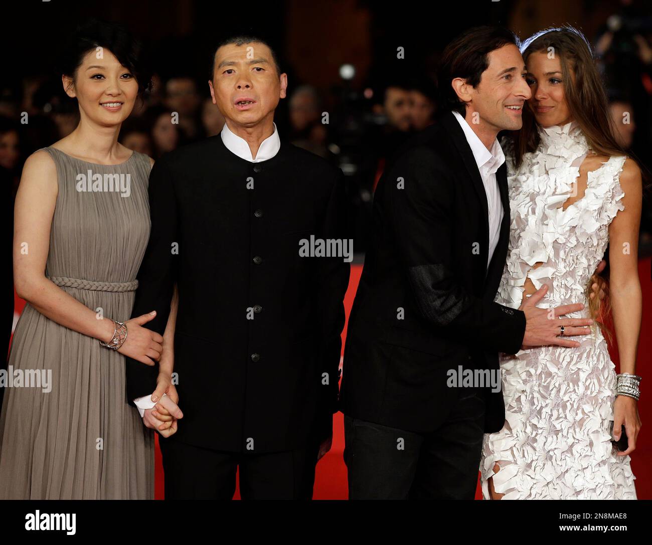 From left, actress Xu Fan, director Feng Xiaogang, actor Adrien Brody and his girlfriend Lara ...