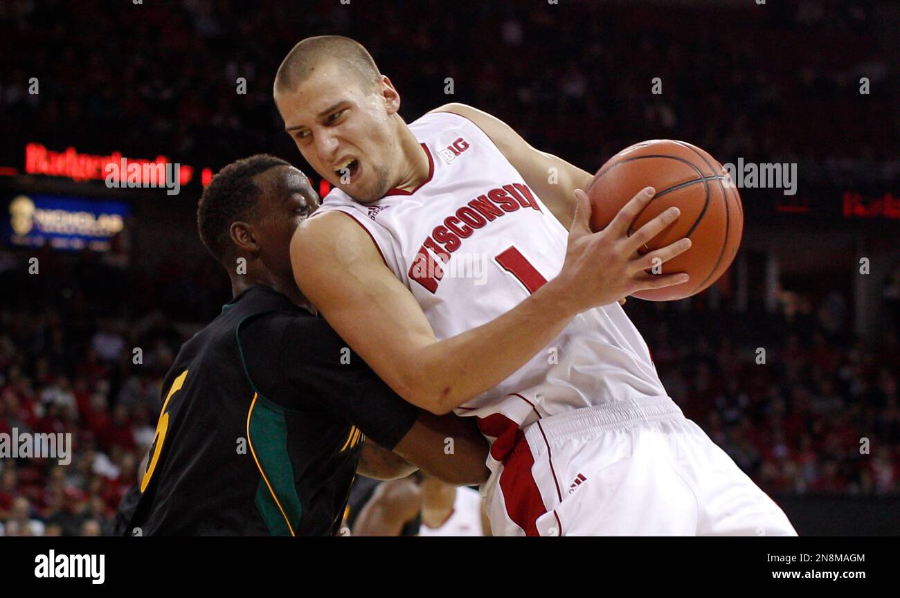 Wisconsin's Ben Brust (1) drives on Southeastern Louisiana's Brandon ...