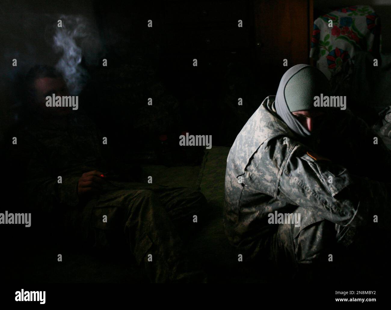 FILE - U.S. Army Pfc. Matthew Fazio, right, 25, bundles up against the ...