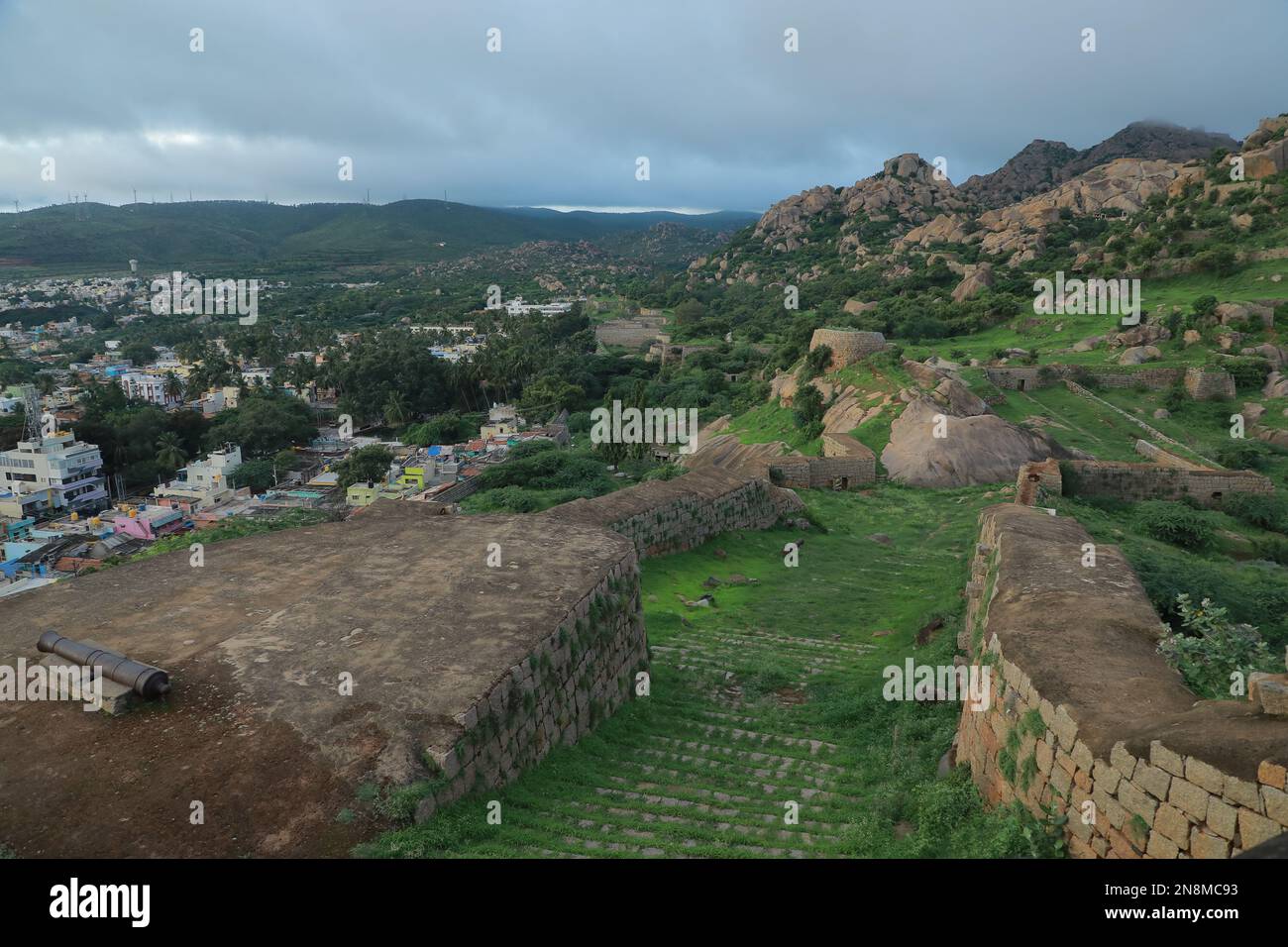 A scenic green and rocky area of Chitradurga Fort and a village on the ...
