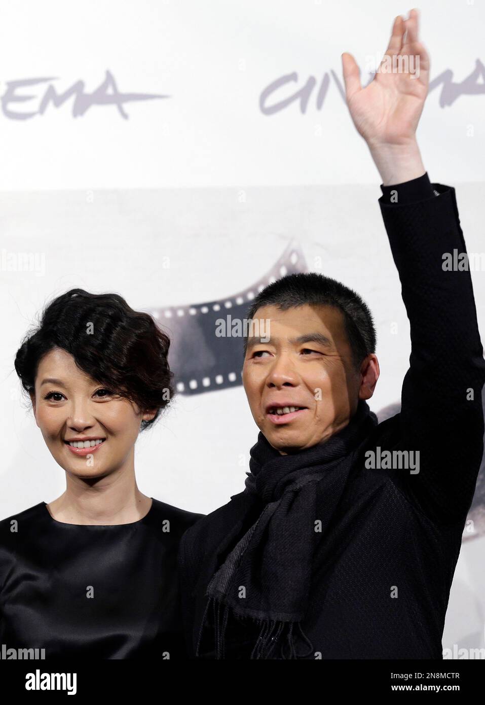 Director Feng Xiaogang and actress Xu Fan pose during a photocall ...