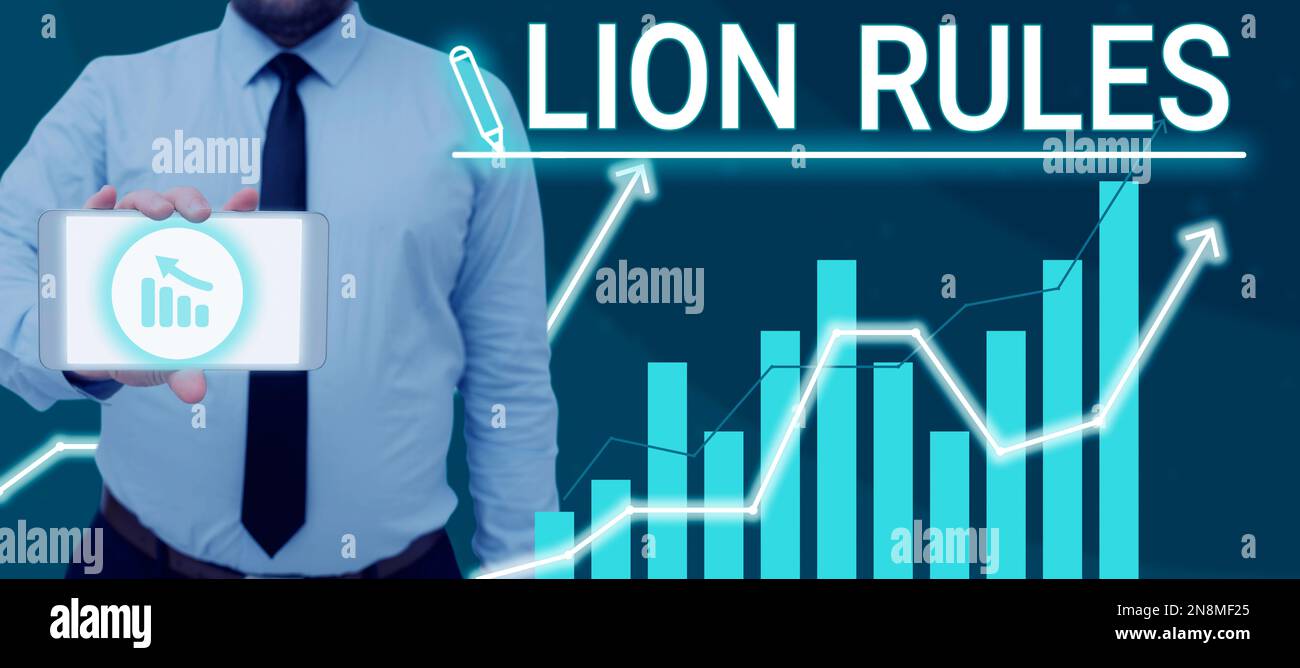 Sign displaying Lion Rules. Word Written on epitome of strength power ...